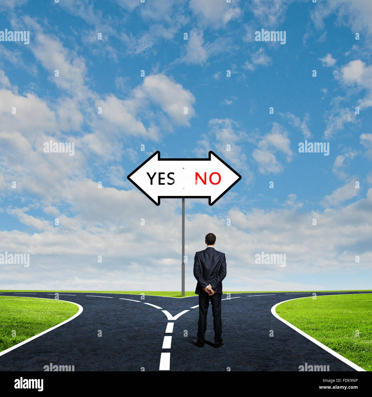 Back view of businessman standing at crossroads. Choice concept Stock ...