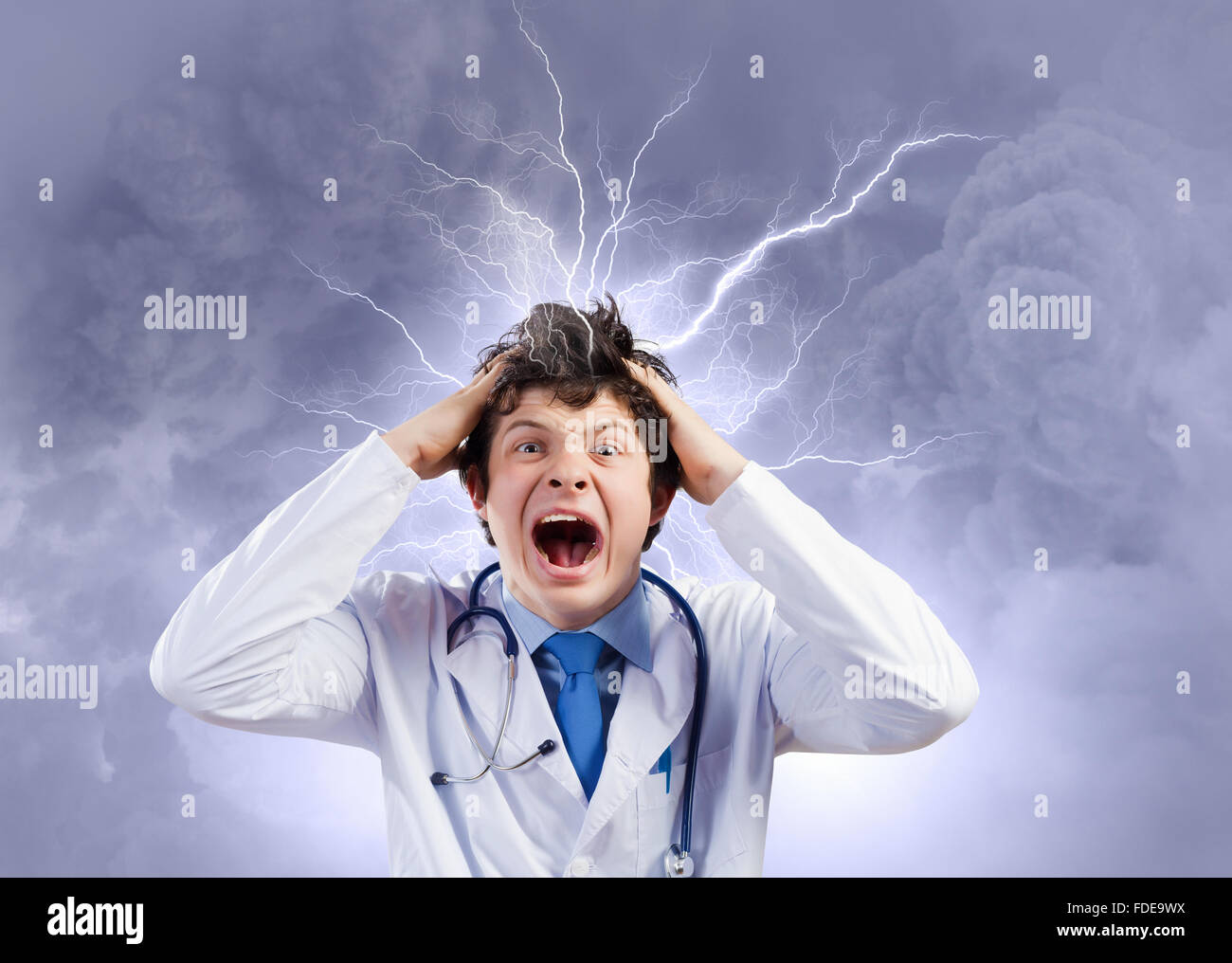 Young mad doctor in white uniform screaming Stock Photo - Alamy