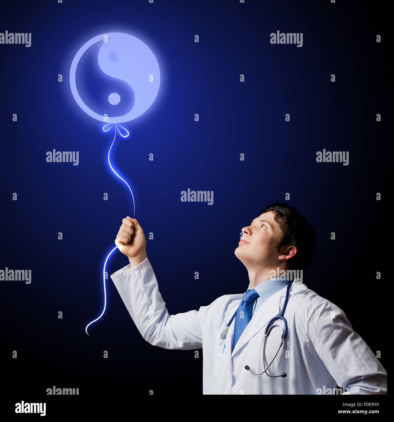 Image of young male doctor and sign of yin yang Stock Photo - Alamy