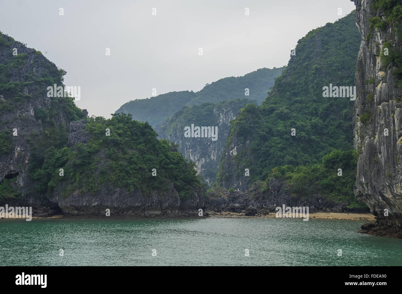 Beautiful limestone mountain scenery with beach at Ha Long Bay, North ...