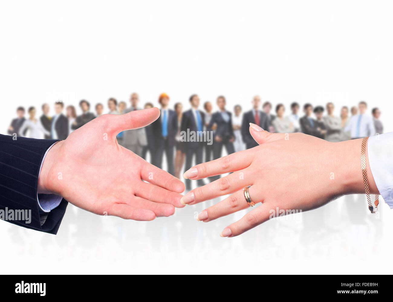 Handshake of business people with people at background Stock Photo - Alamy