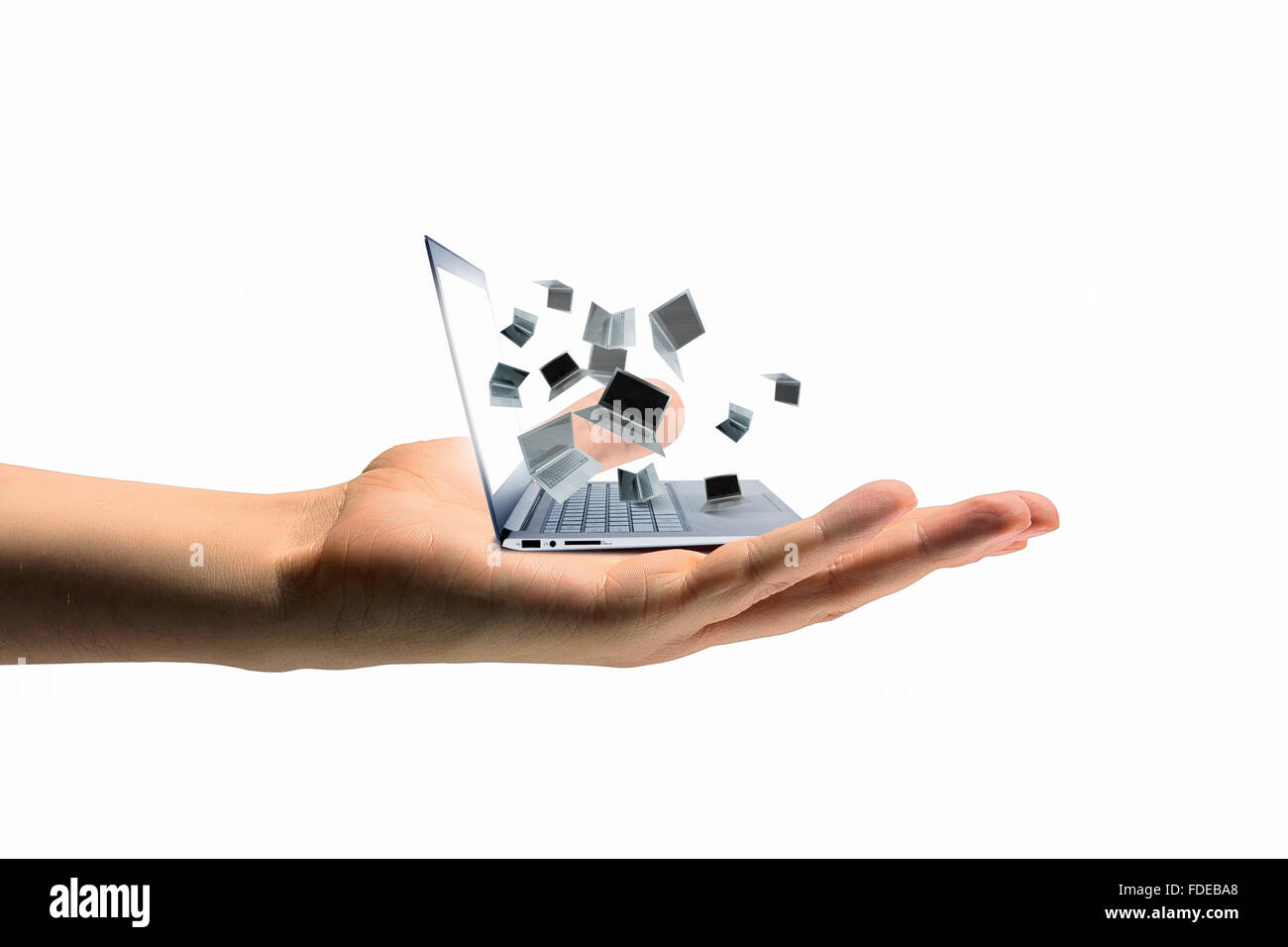 Pile of laptops in human hand. Technology concept Stock Photo - Alamy