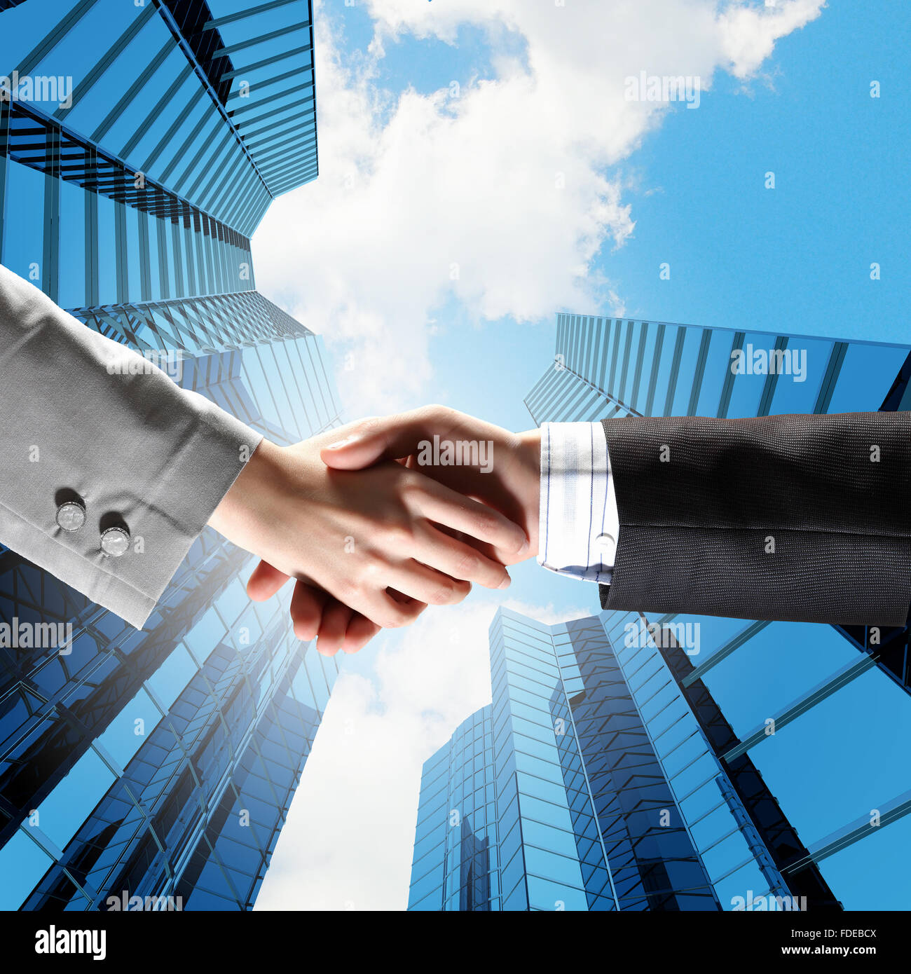 Close up image of hand shake against skyscrapers Stock Photo - Alamy