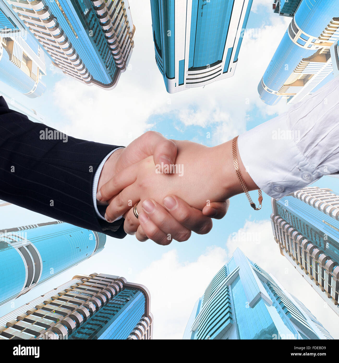 Close up image of hand shake against skyscrapers Stock Photo - Alamy