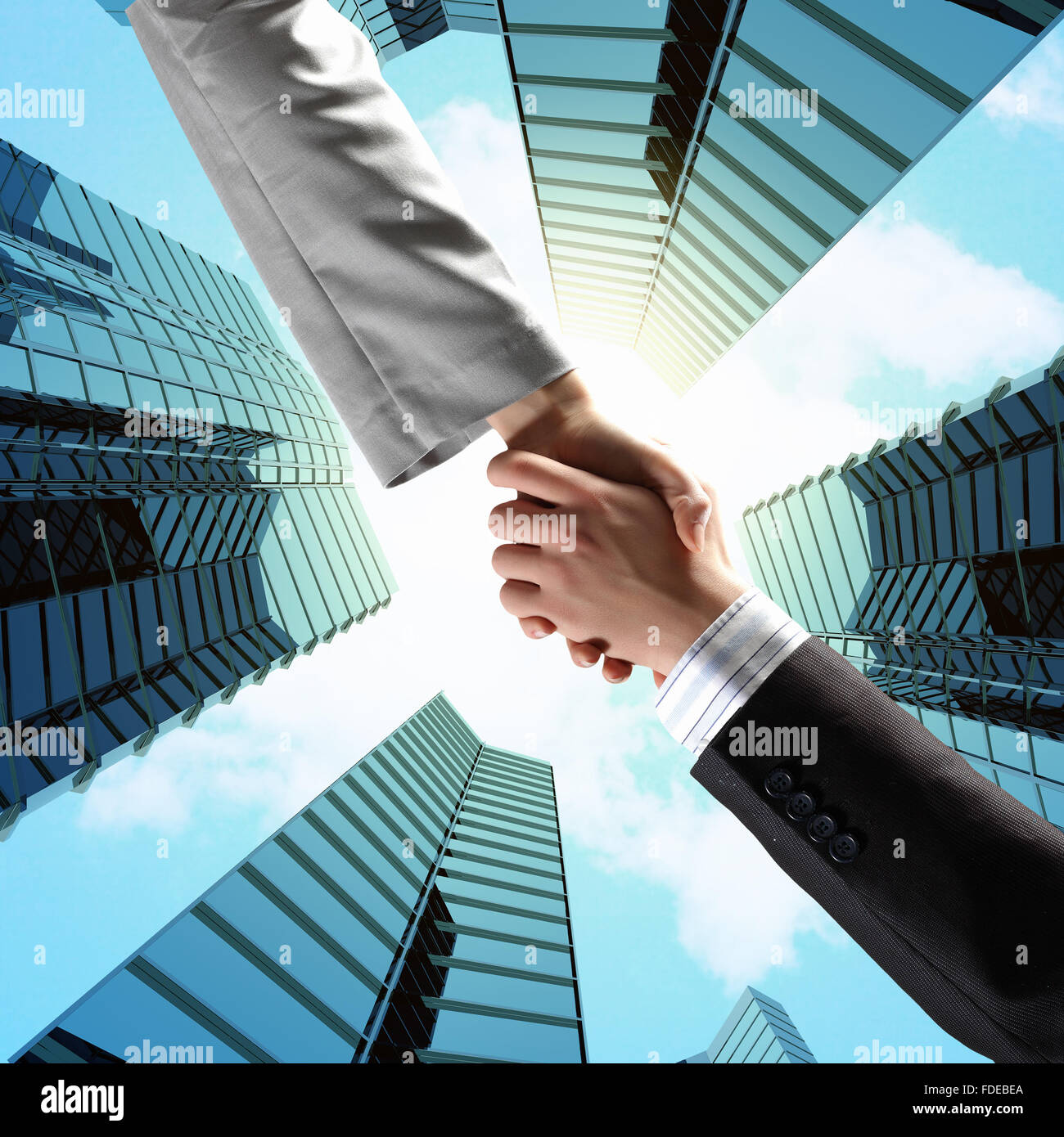 Close up image of hand shake against skyscrapers Stock Photo - Alamy