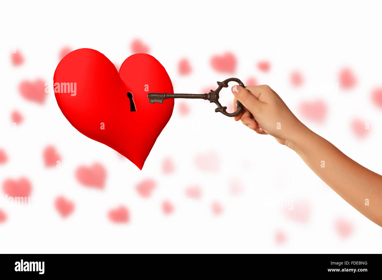 Close up of human hand with key opening heart Stock Photo - Alamy