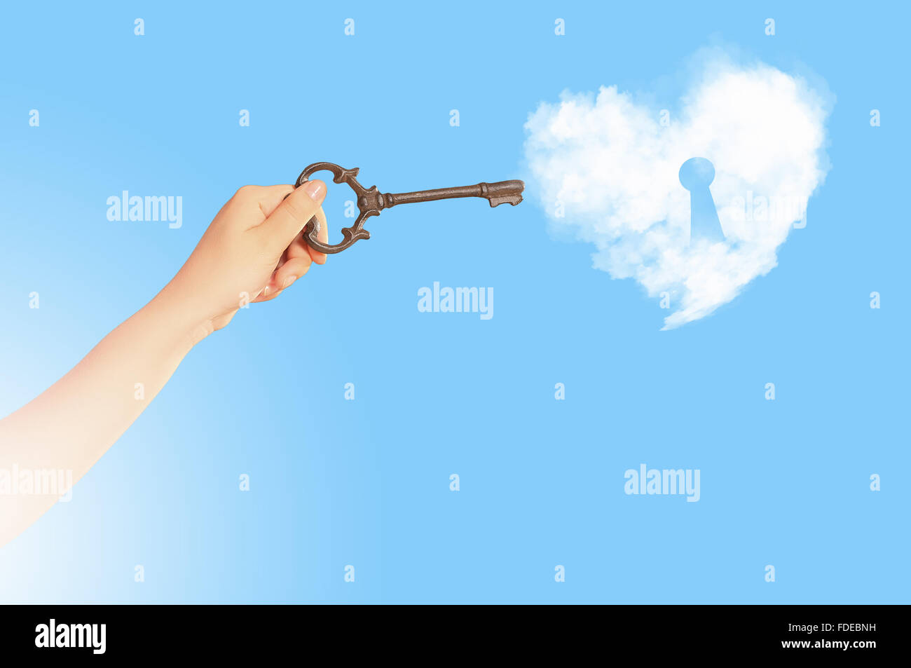 Close up of human hand with key opening heart Stock Photo - Alamy