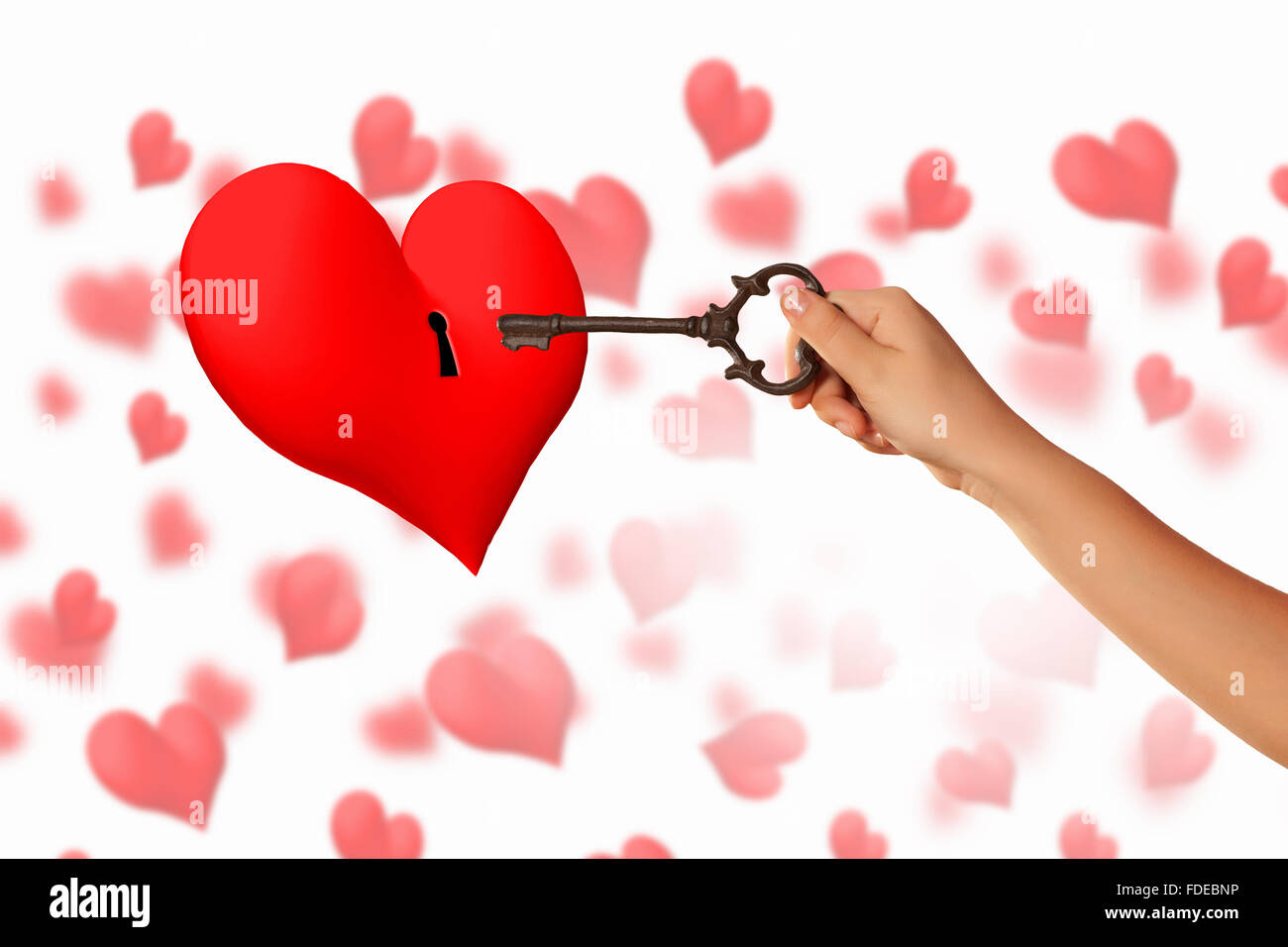 Close up of human hand with key opening heart Stock Photo - Alamy