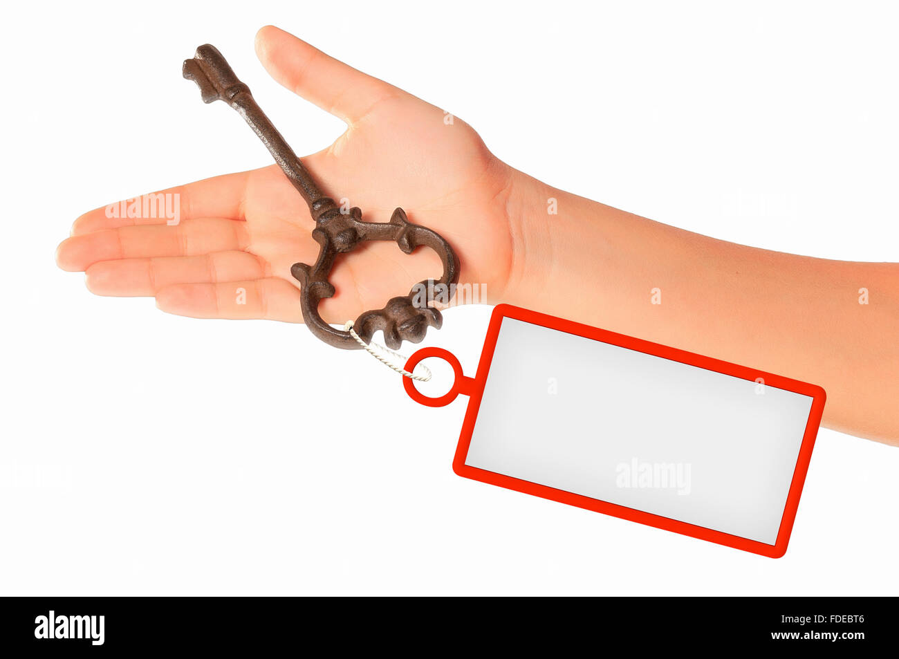 Image of key with blank label in human hand Stock Photo - Alamy