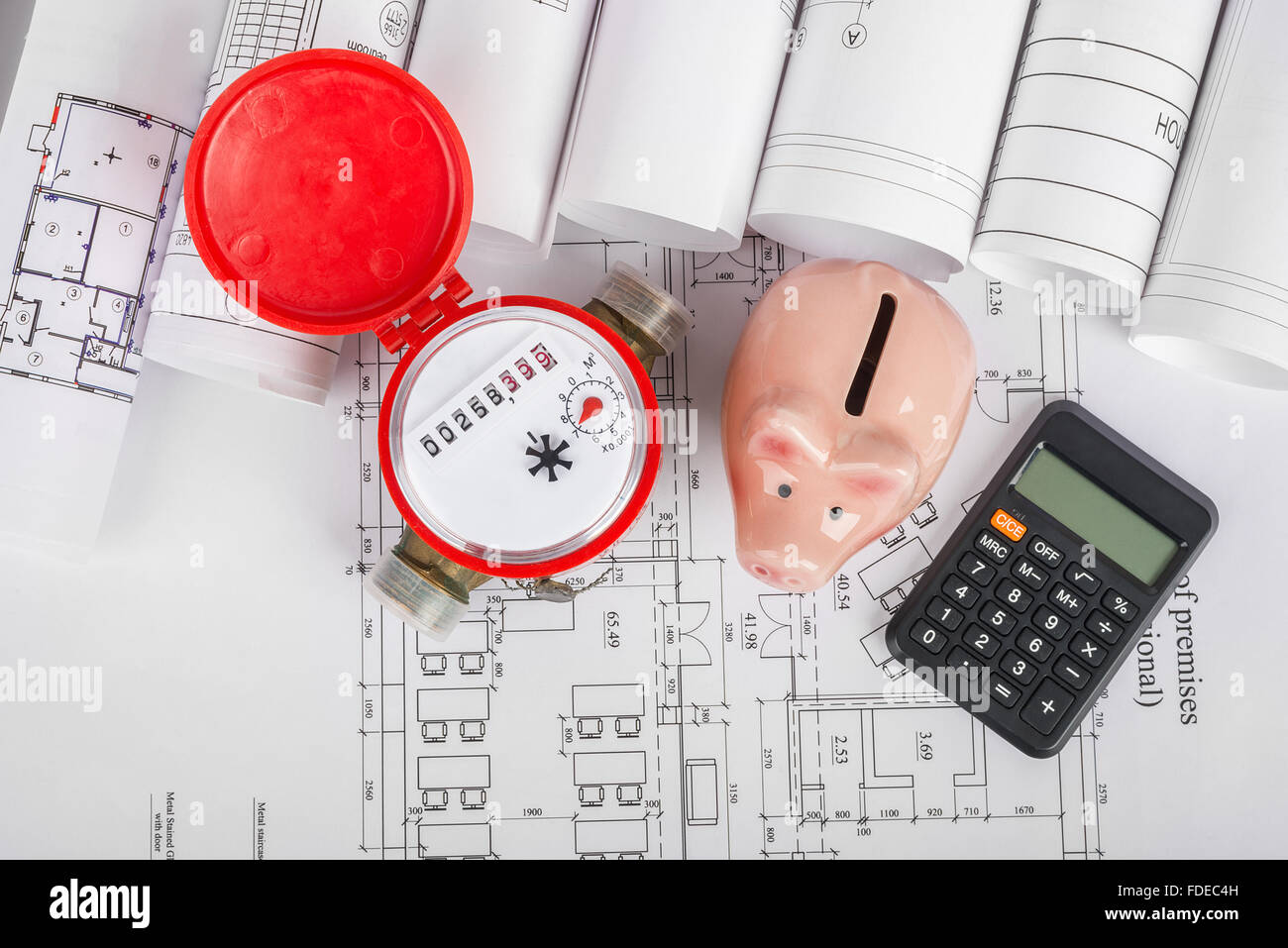 Water meter with calculator on blueprint Stock Photo - Alamy