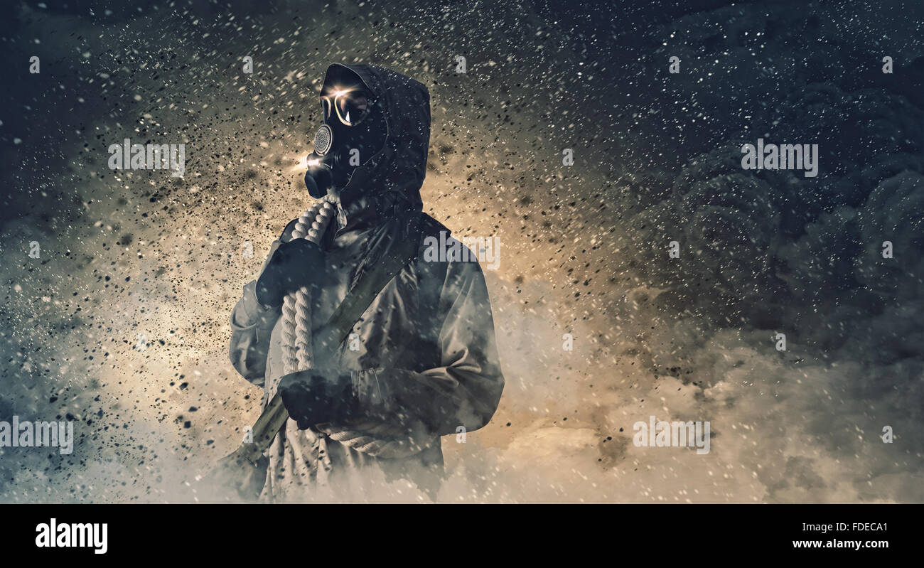Man in gas mask against disaster background. Pollution concept Stock ...