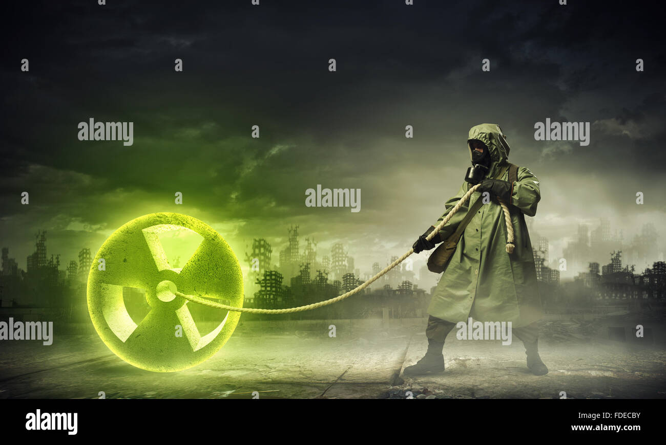 Man in respirator against nuclear background. Radioactivity concept ...