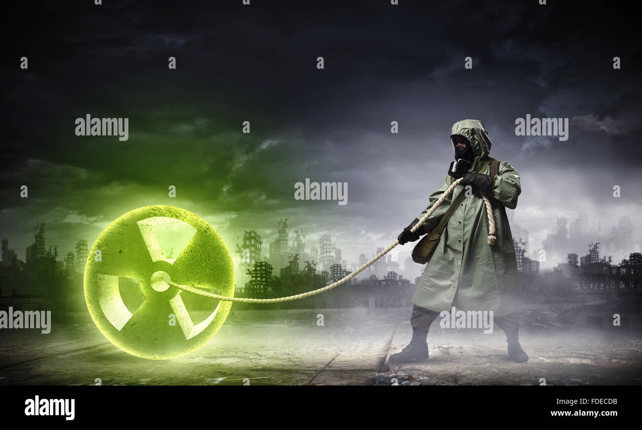 Man in respirator against nuclear background. Radioactivity concept ...