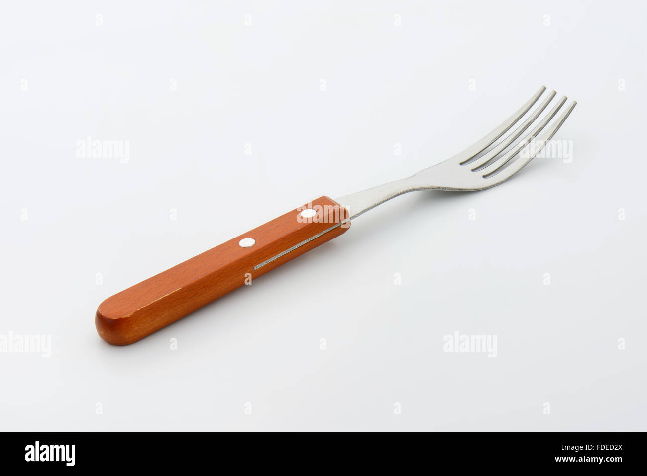 dinner fork with wooden handle Stock Photo - Alamy