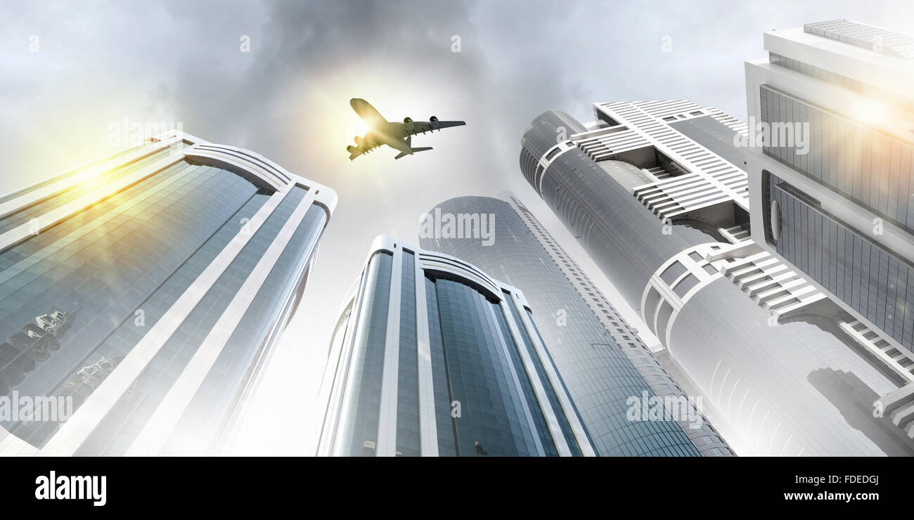 Plane flying above skyscrapers. Business travel concept Stock Photo - Alamy