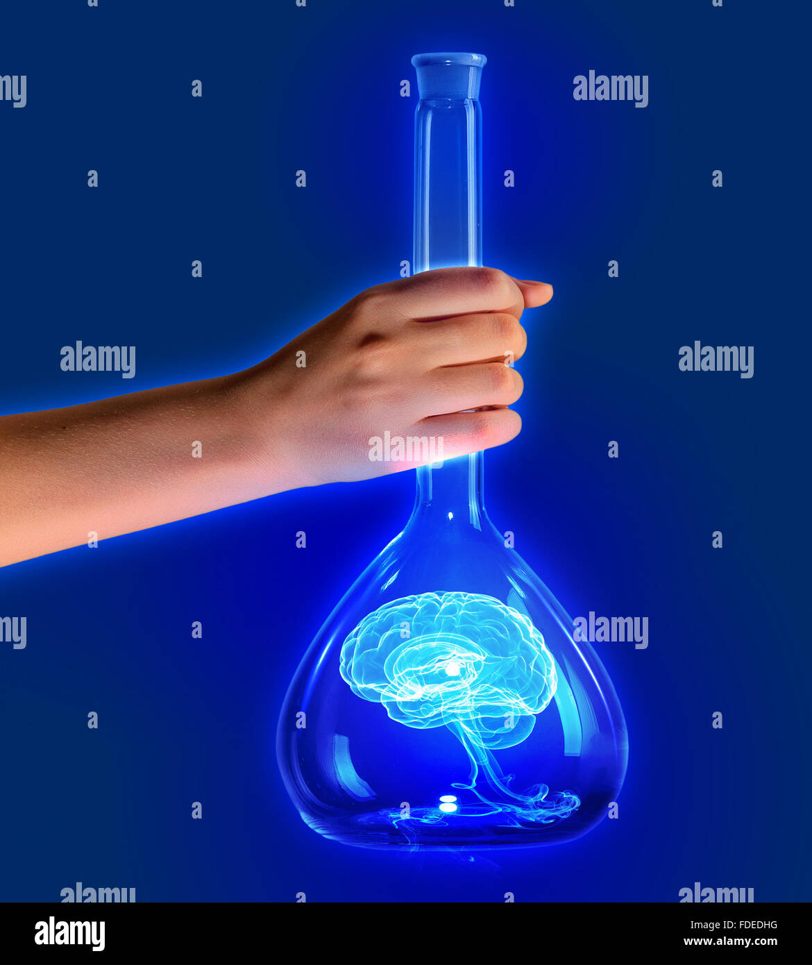 Human hand holding test tube with brain illustration Stock Photo - Alamy