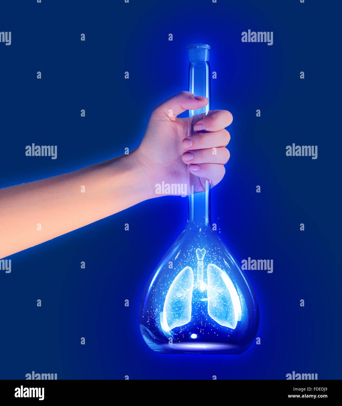 Human hand holding test tube with lungs Stock Photo - Alamy