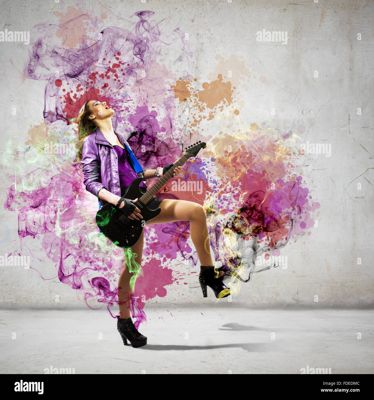 Young attractive rock girl playing the electric guitar Stock Photo - Alamy