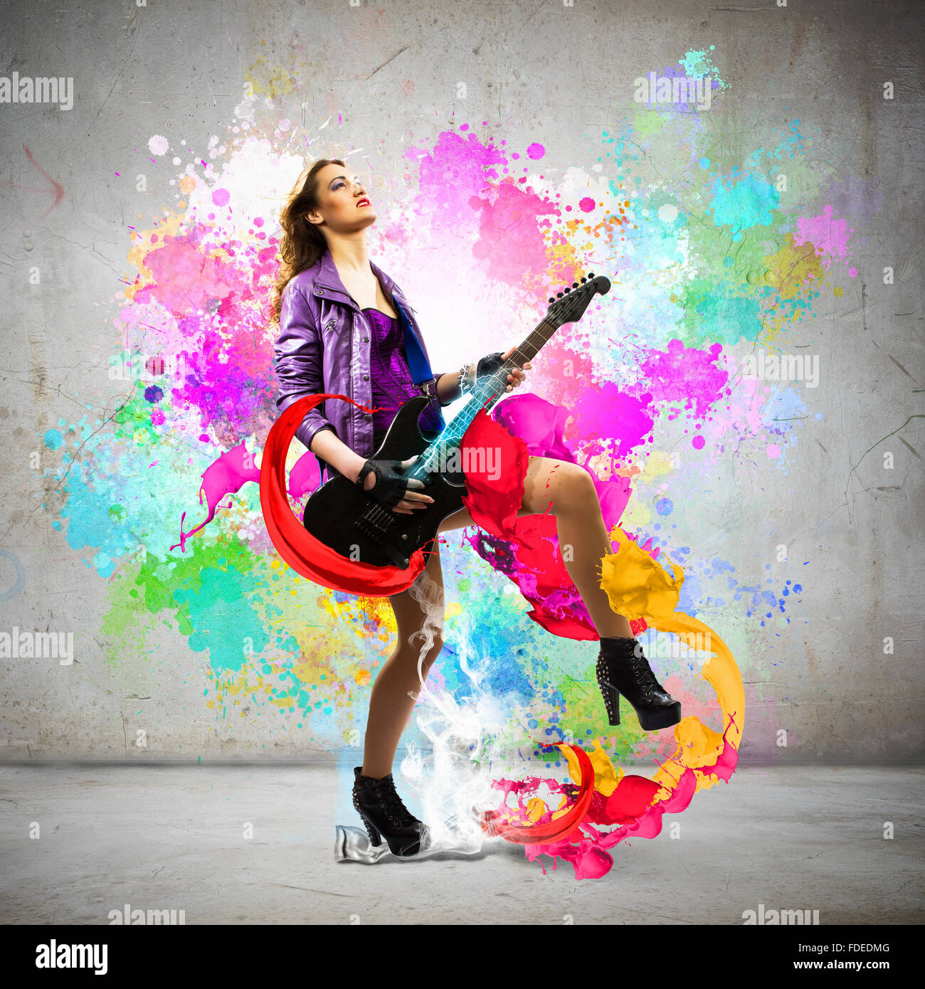 Young attractive rock girl playing the electric guitar Stock Photo - Alamy