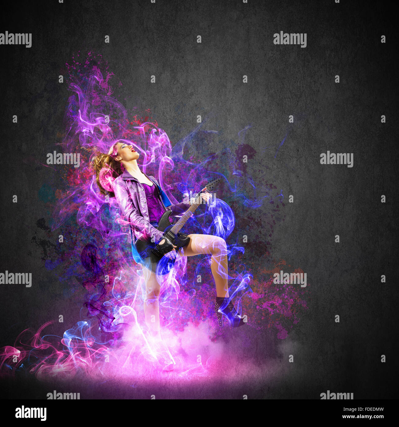 Young attractive rock girl playing the electric guitar Stock Photo - Alamy