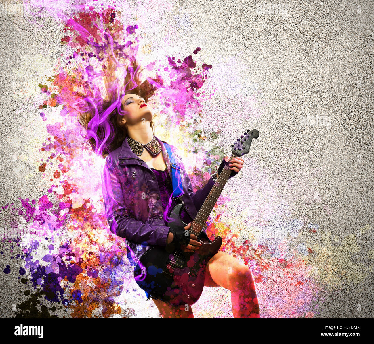 Young attractive rock girl playing the electric guitar Stock Photo - Alamy