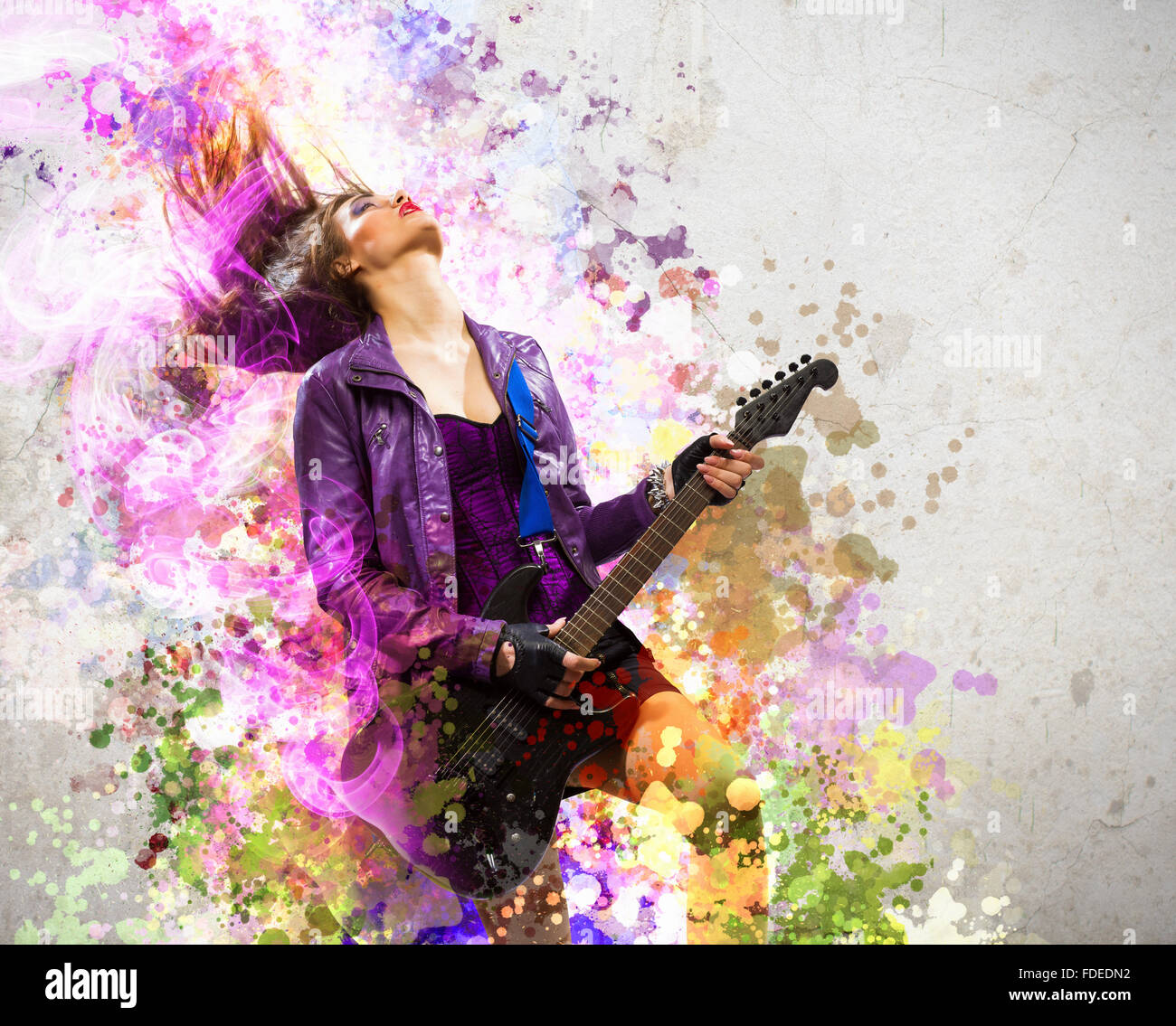 Young attractive rock girl playing the electric guitar Stock Photo - Alamy