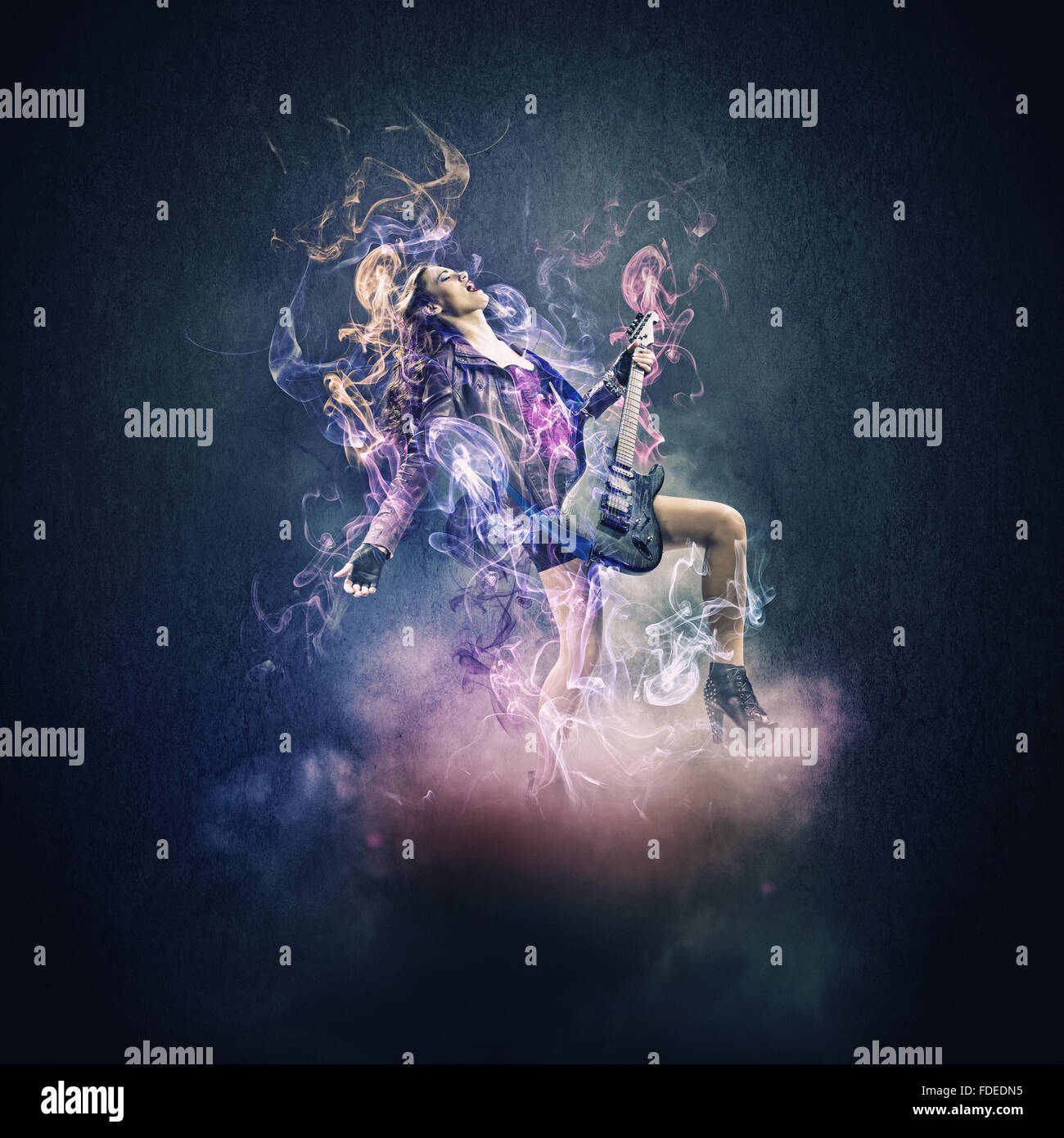 Young attractive rock girl playing the electric guitar Stock Photo - Alamy