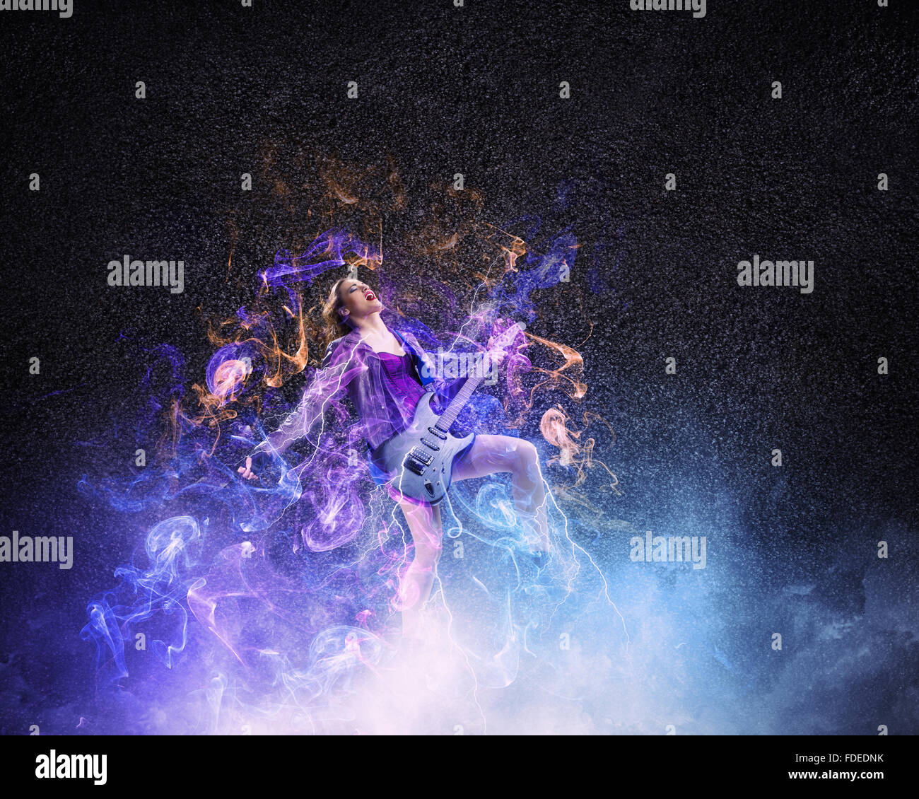 Young attractive rock girl playing the electric guitar Stock Photo - Alamy