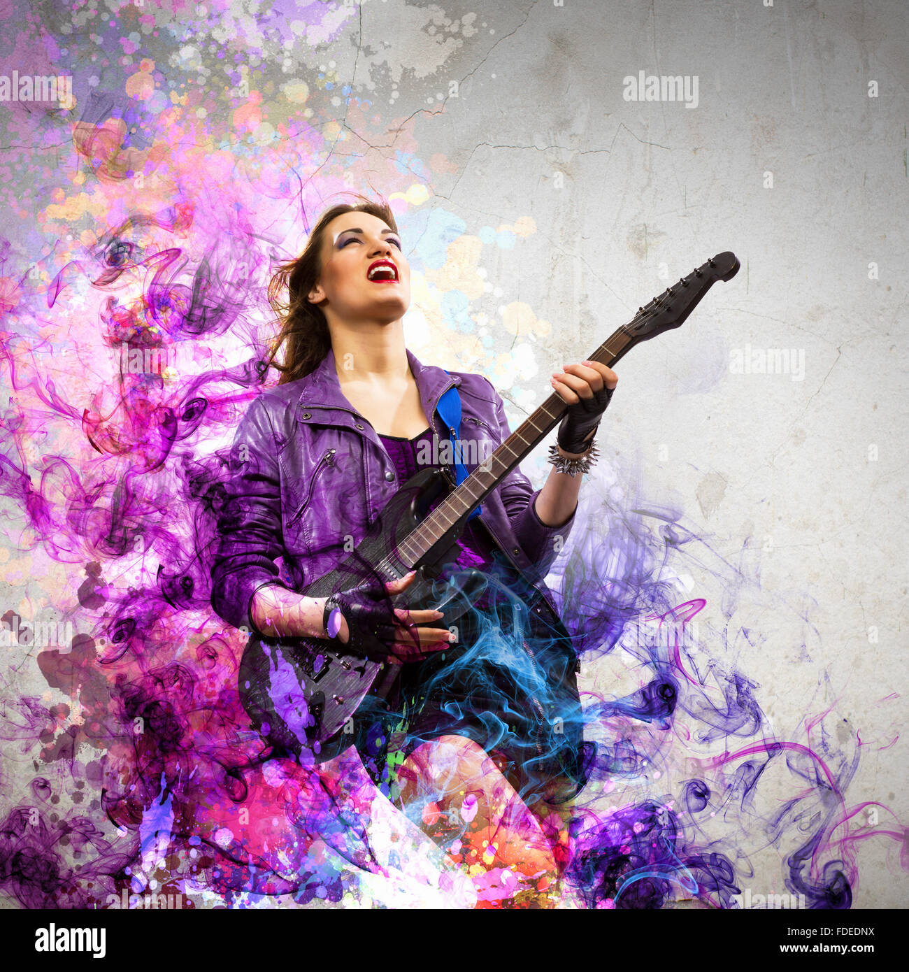 Young attractive rock girl playing the electric guitar Stock Photo - Alamy