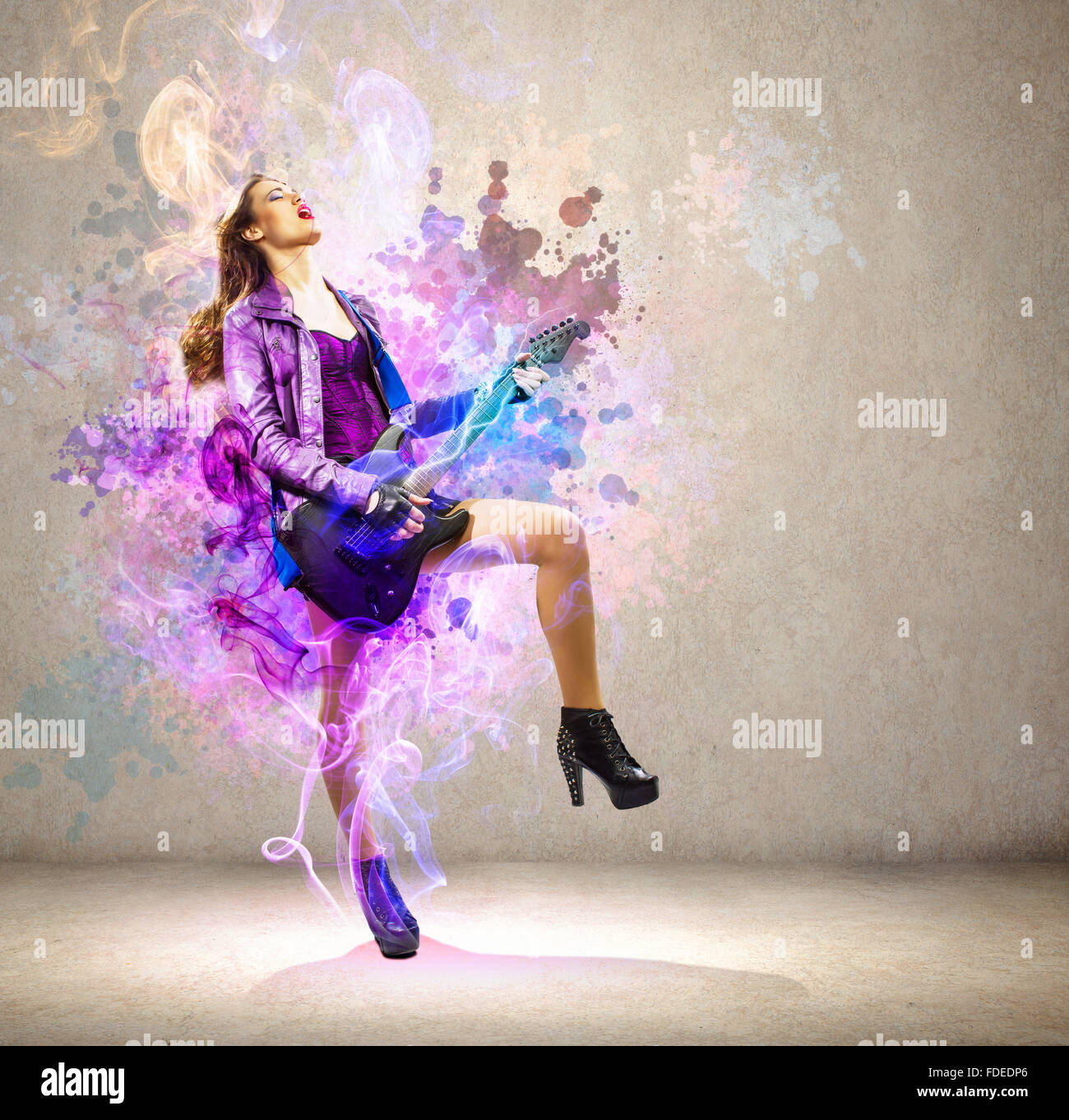 Young attractive rock girl playing the electric guitar Stock Photo - Alamy