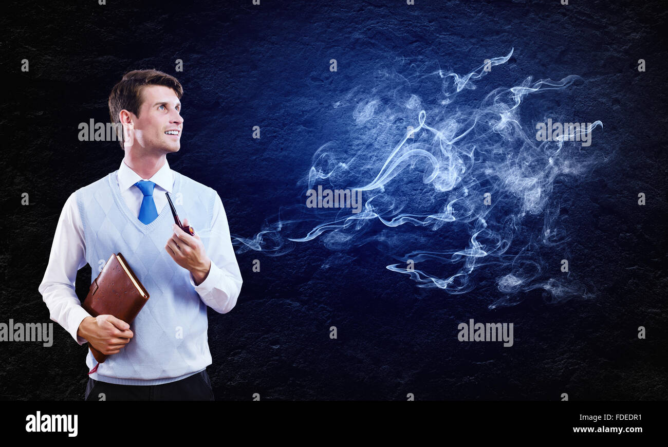 Young handsome businessman smoking pipe against black background Stock ...