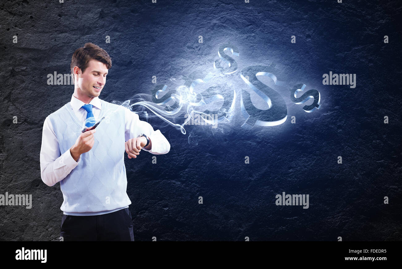 Young handsome businessman smoking pipe. Money making Stock Photo - Alamy