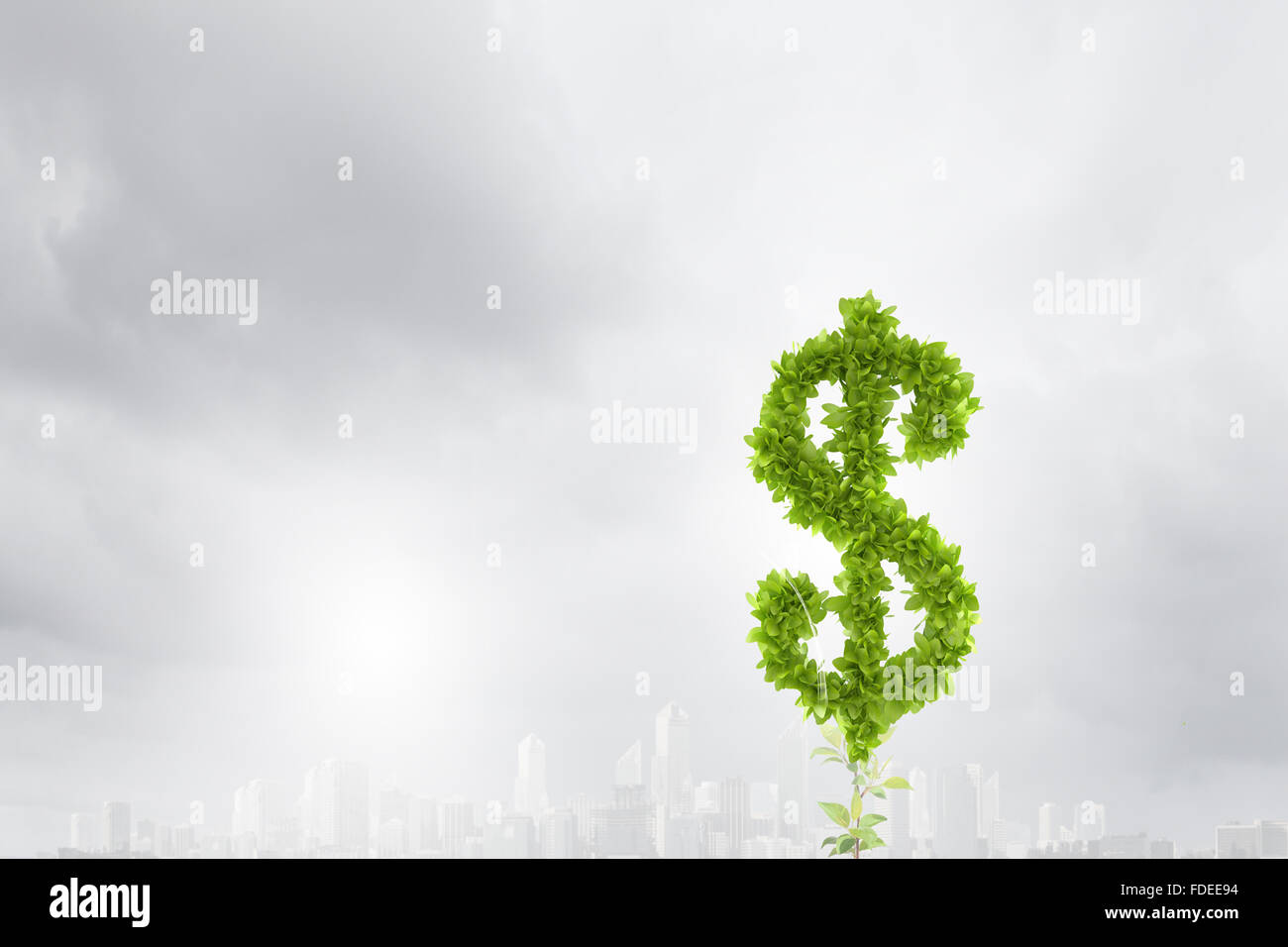 Conceptual image of plant shaped like dollar sign Stock Photo - Alamy