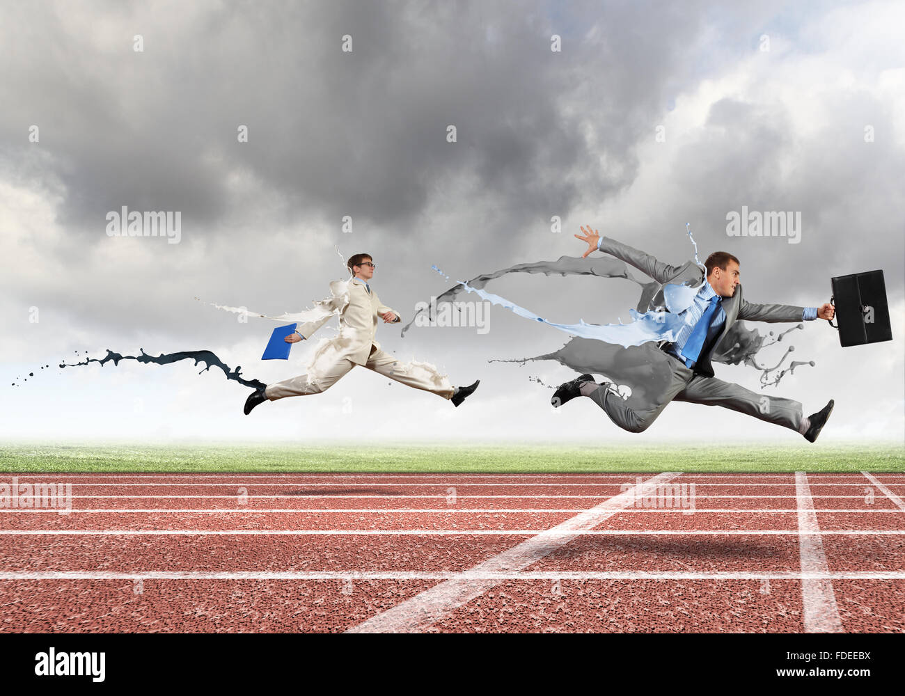 Funny image of young businesspeople running at stadium Stock Photo - Alamy