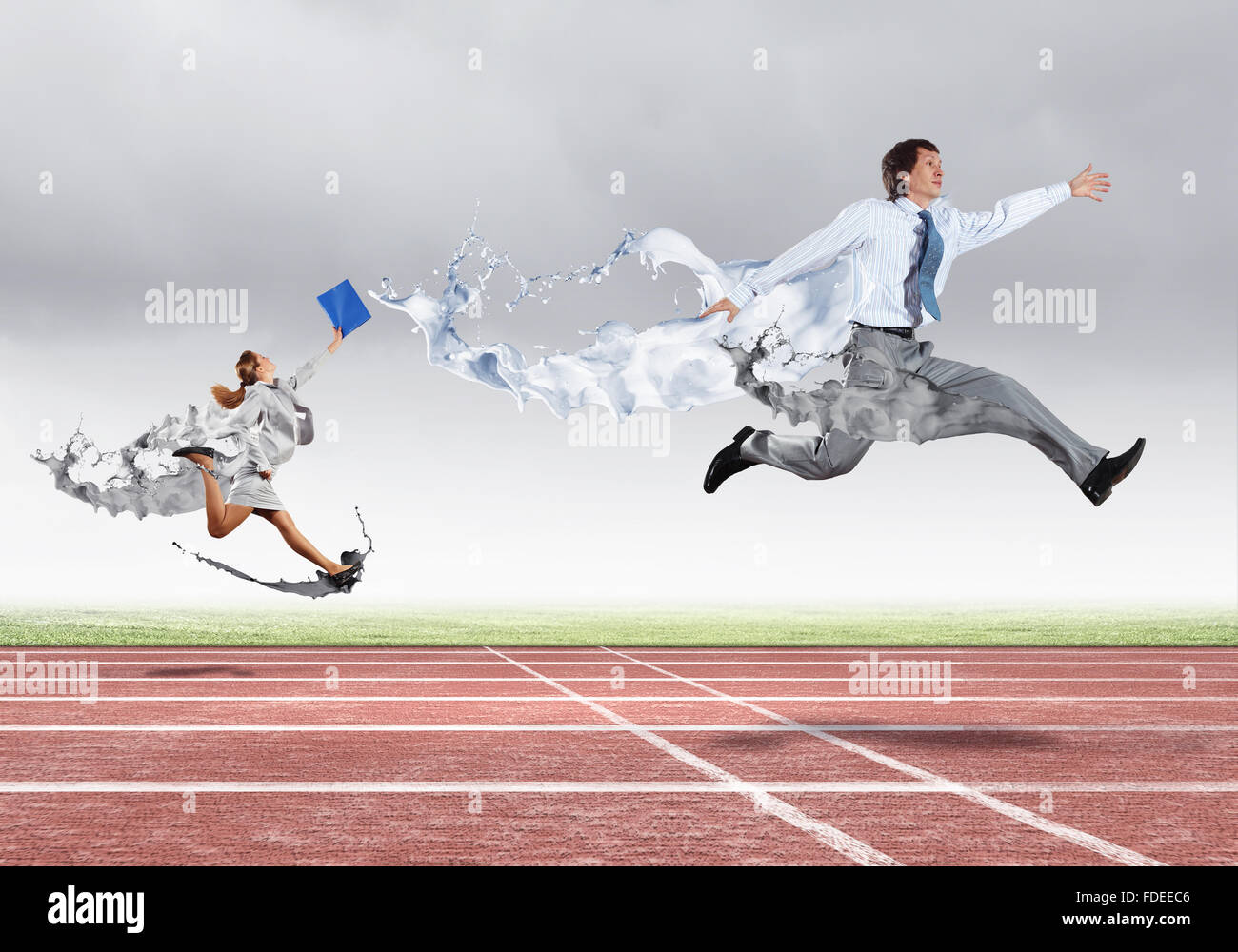 Funny image of young businesspeople running at stadium Stock Photo - Alamy