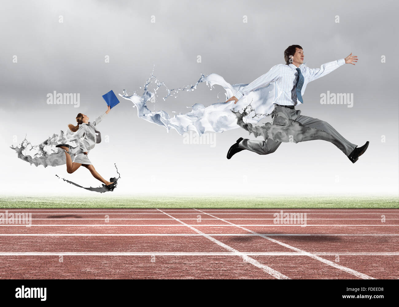 Funny image of young businesspeople running at stadium Stock Photo - Alamy