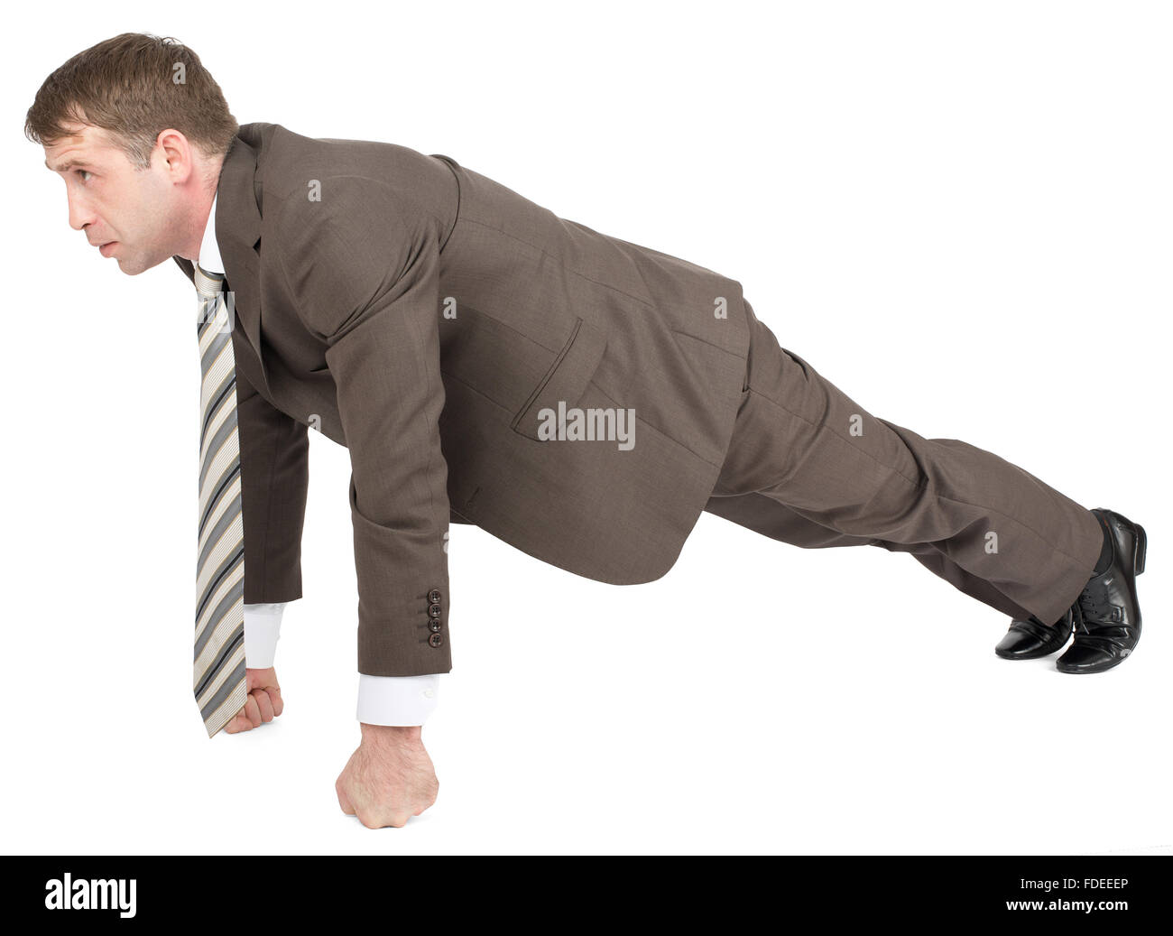 Businessman doing push-ups on fists Stock Photo - Alamy