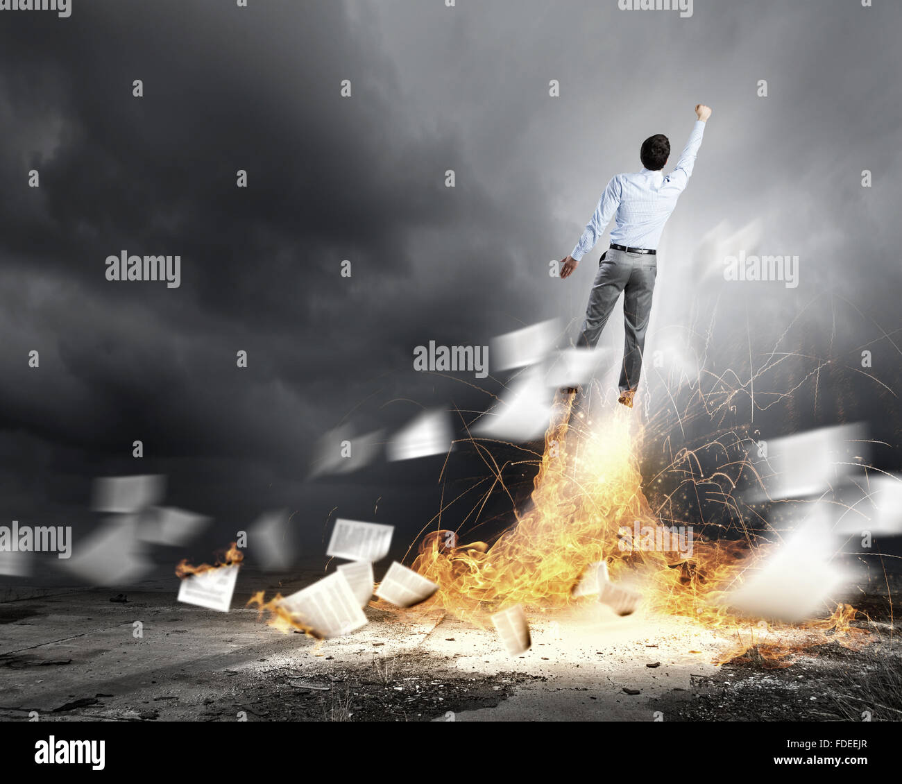 Rear view of businessman superhero flying up in sky Stock Photo - Alamy