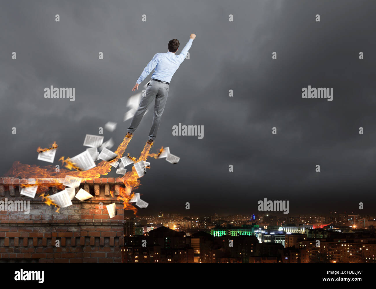 Rear view of businessman superhero flying up in sky Stock Photo - Alamy