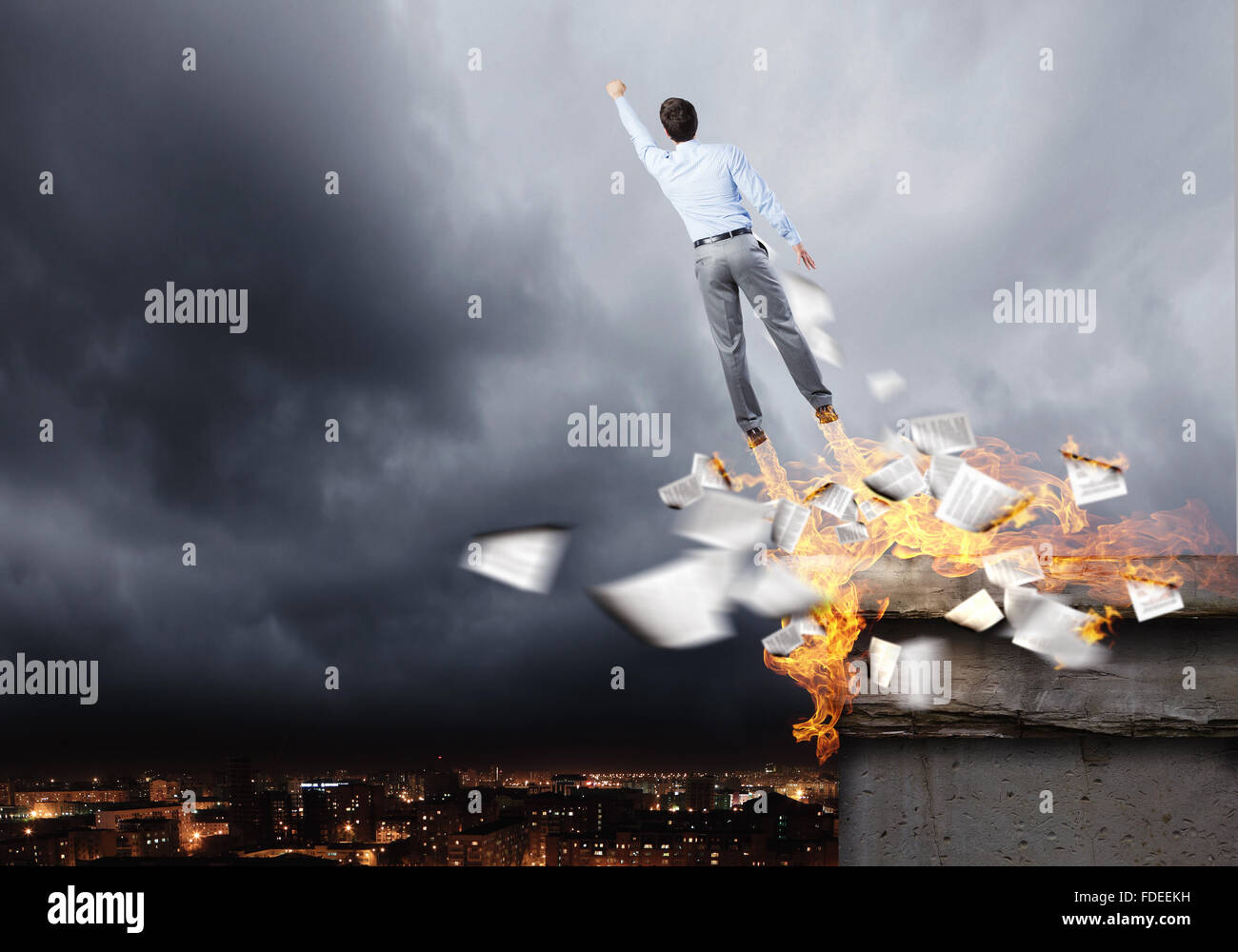 Rear view of businessman superhero flying up in sky Stock Photo - Alamy
