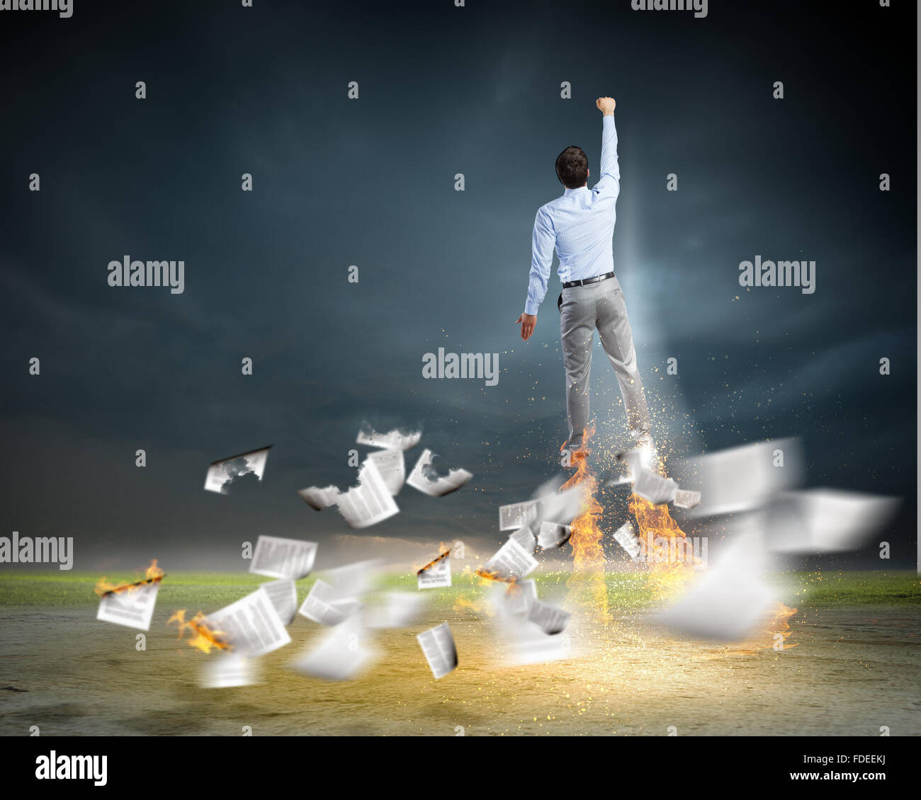 Rear view of businessman superhero flying up in sky Stock Photo - Alamy