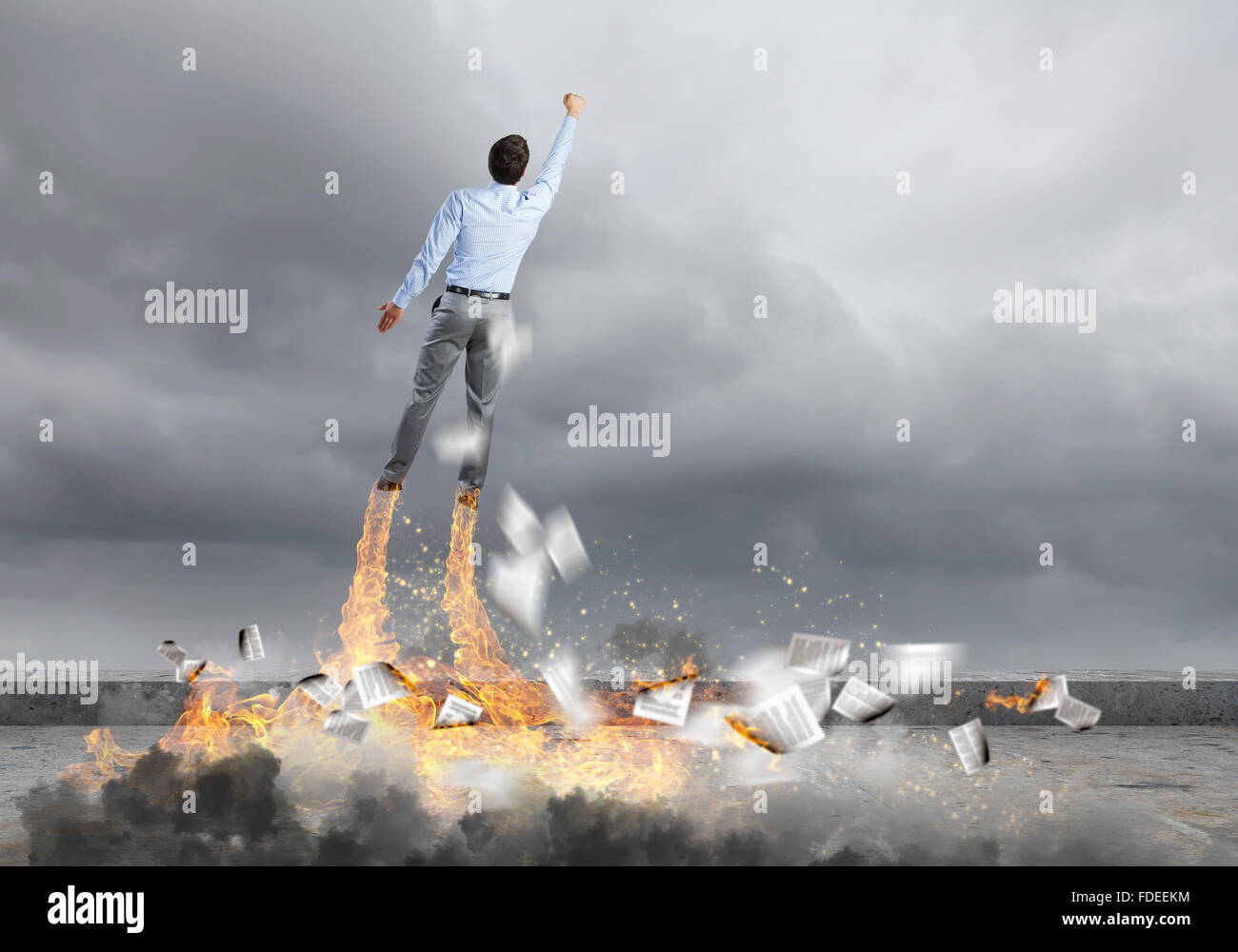 Rear view of businessman superhero flying up in sky Stock Photo - Alamy