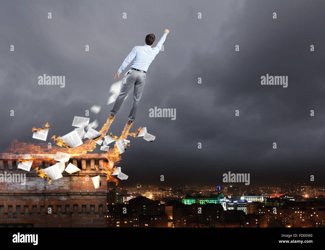 Rear view of businessman superhero flying up in sky Stock Photo - Alamy
