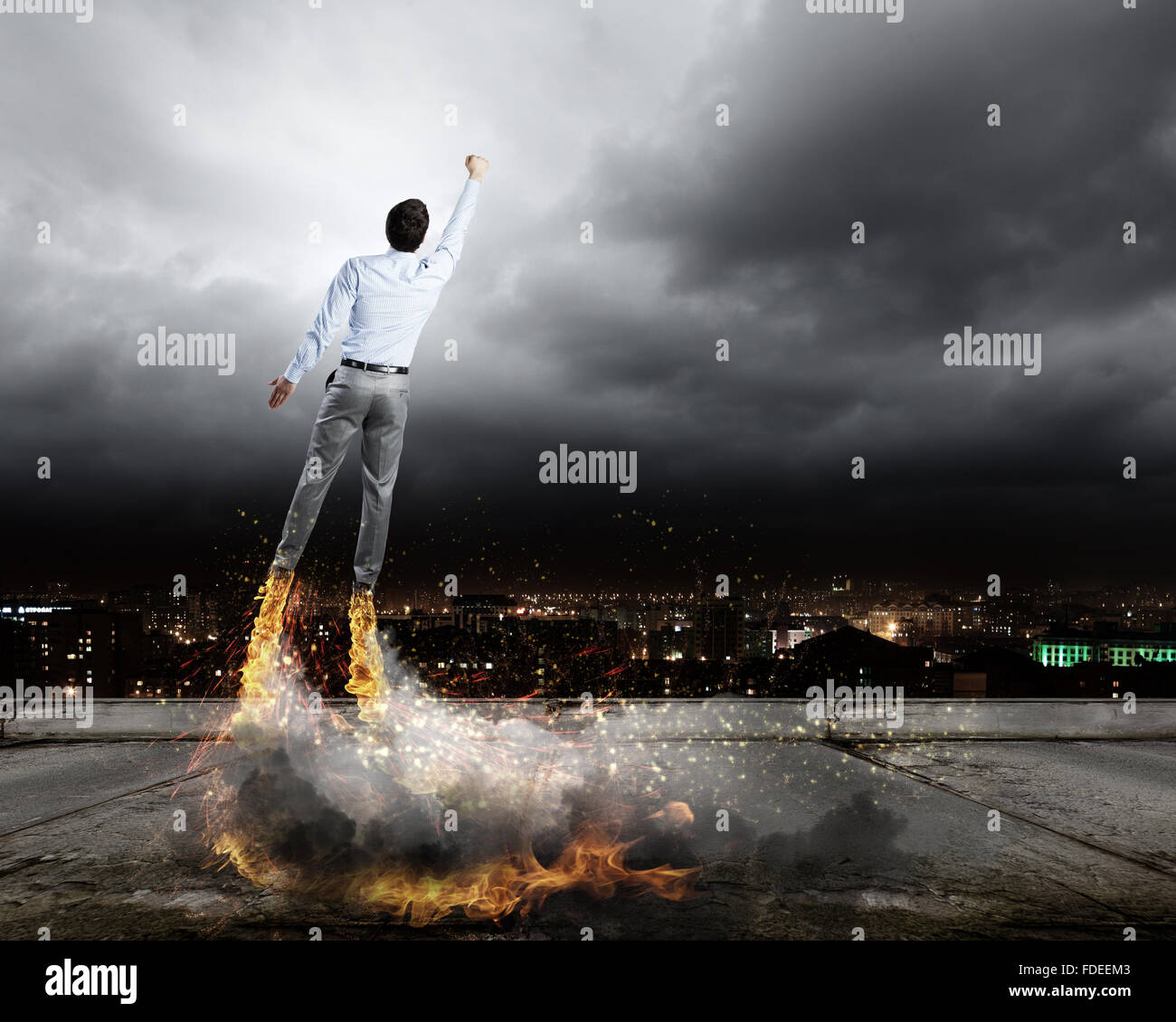 Rear view of businessman superhero flying up in sky Stock Photo - Alamy