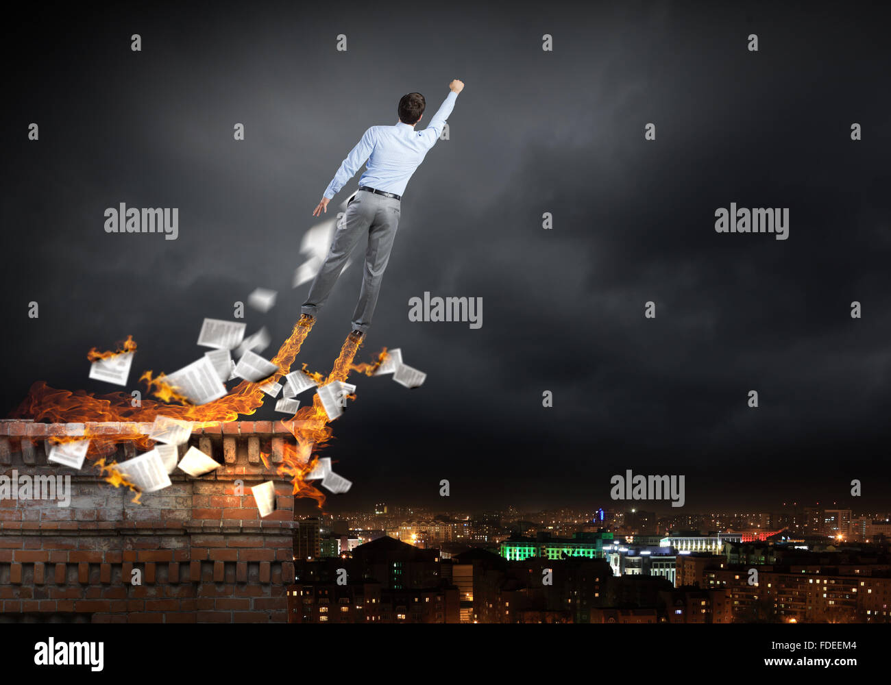 Rear view of businessman superhero flying up in sky Stock Photo - Alamy