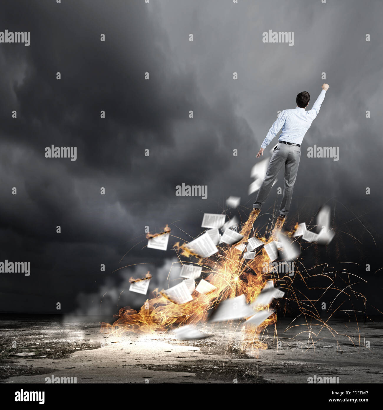 Rear view of businessman superhero flying up in sky Stock Photo - Alamy