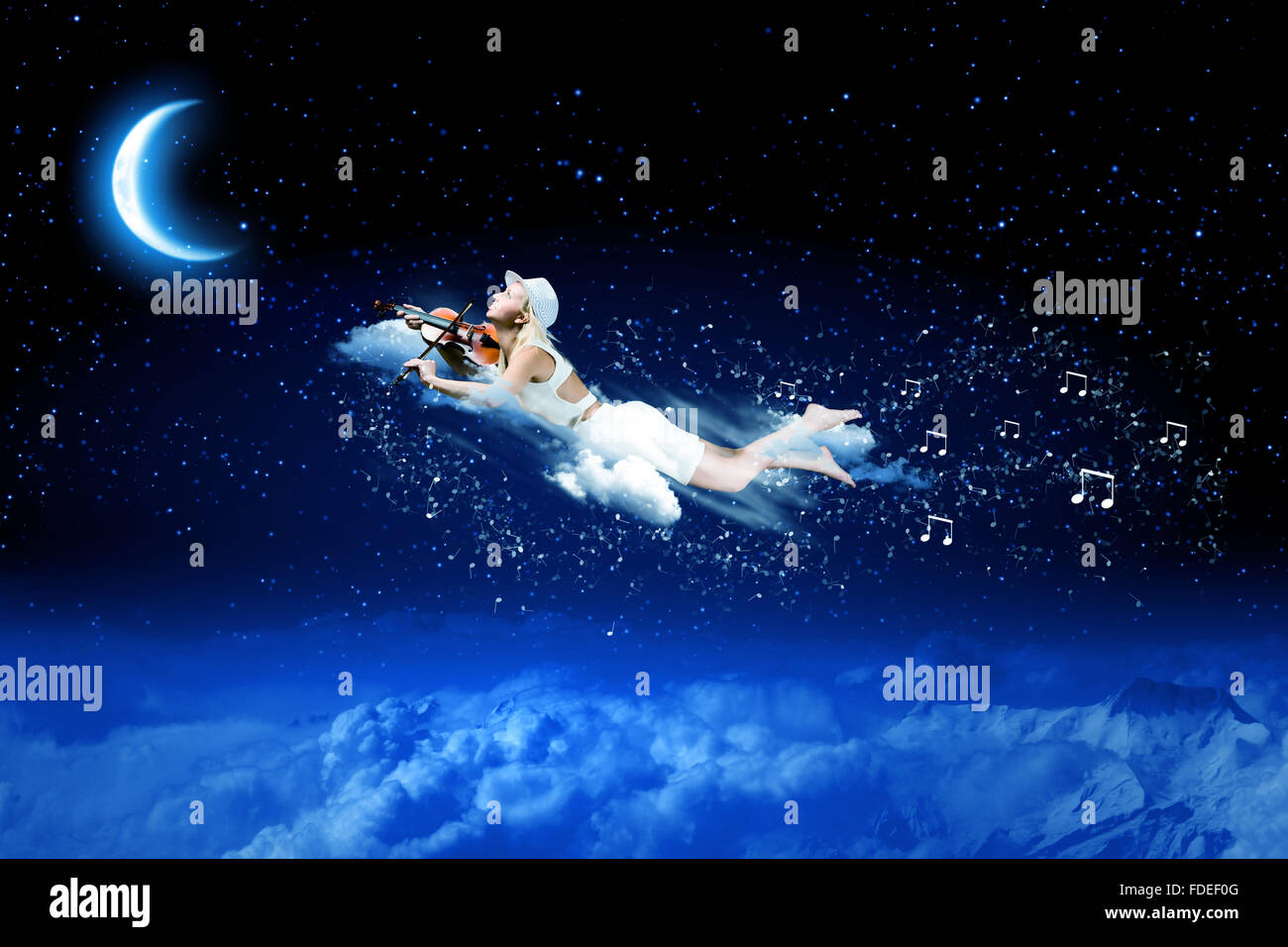 Young blond girl flying in night sky Stock Photo - Alamy