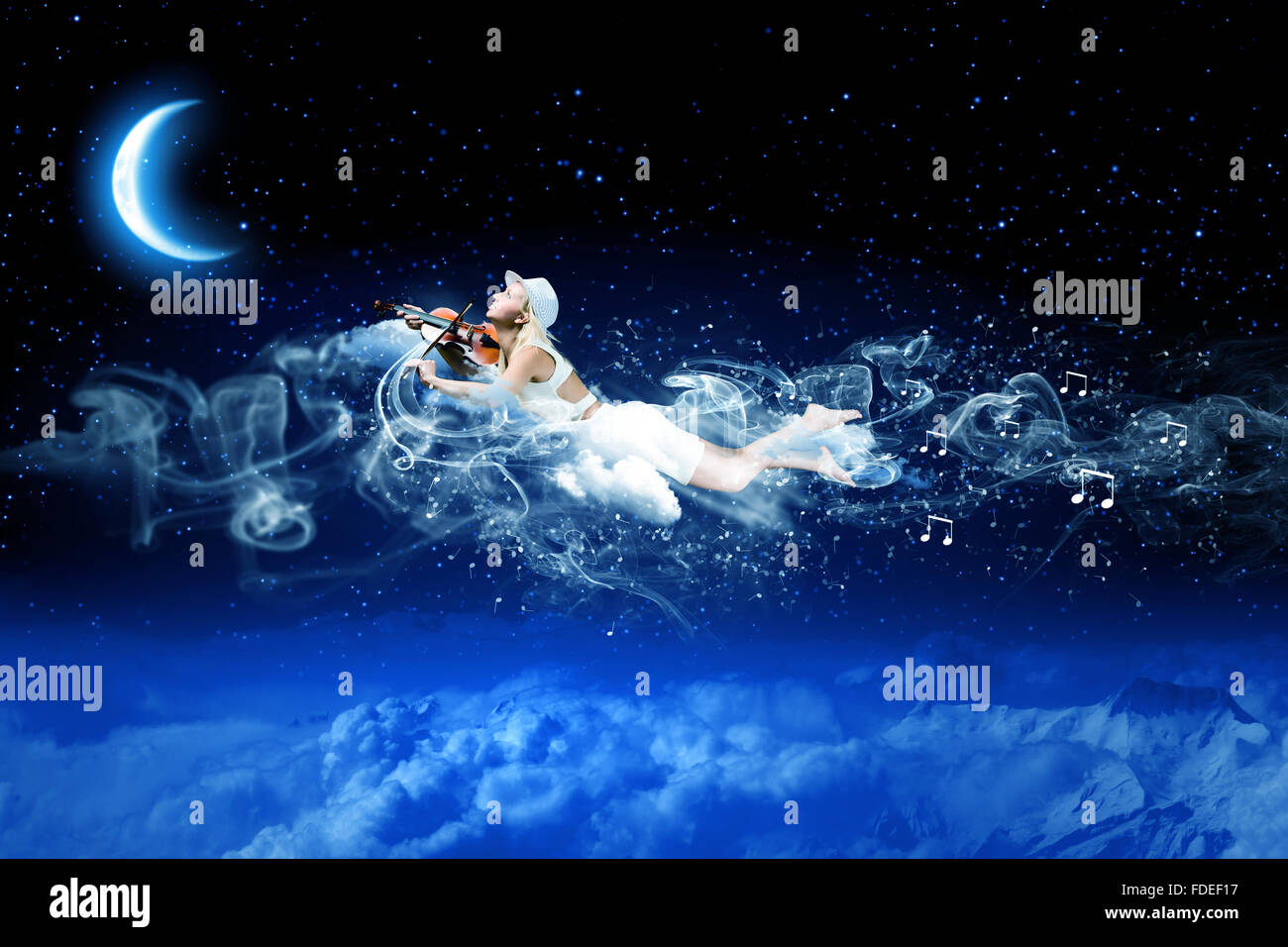 Young blond girl flying in night sky Stock Photo - Alamy