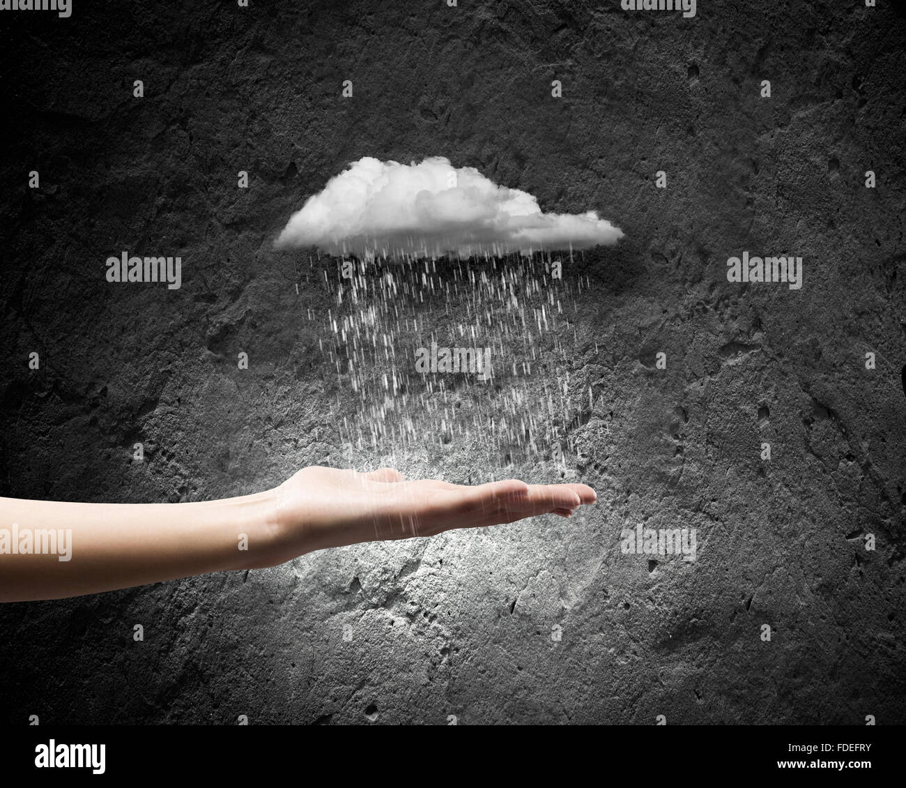 Background conceptual image with raining cloud in hand Stock Photo - Alamy