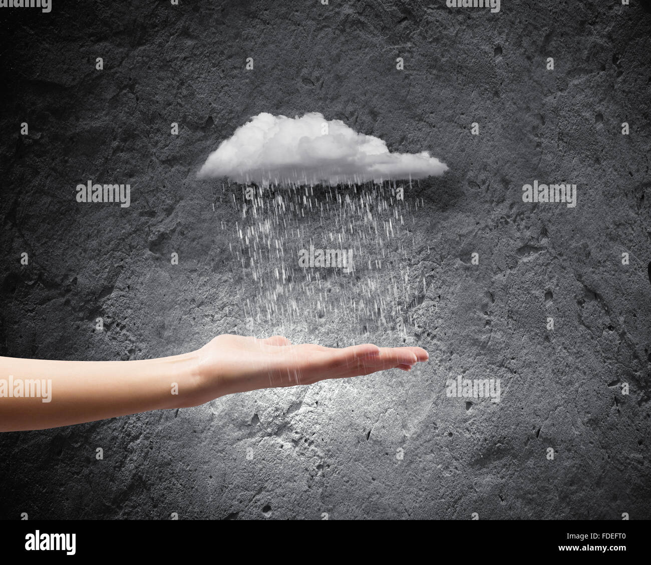 Background conceptual image with raining cloud in hand Stock Photo - Alamy